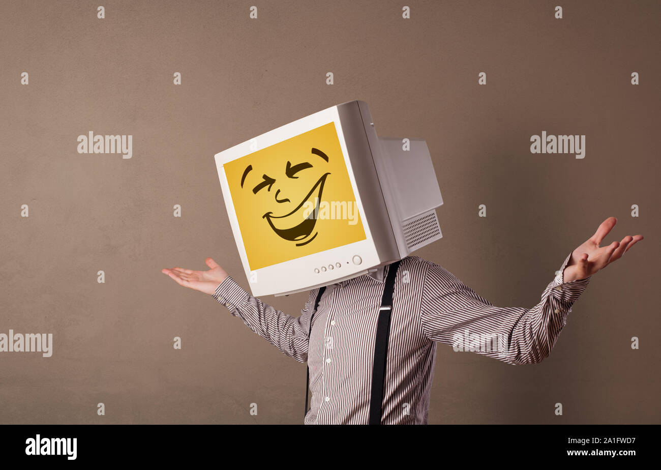 Young person with happy smiley monitor head Stock Photo - Alamy