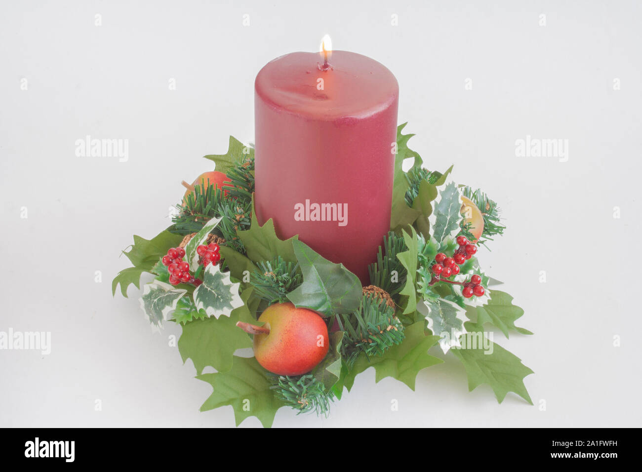 Red lighted candle in the middle of Christmas decorations Stock Photo ...