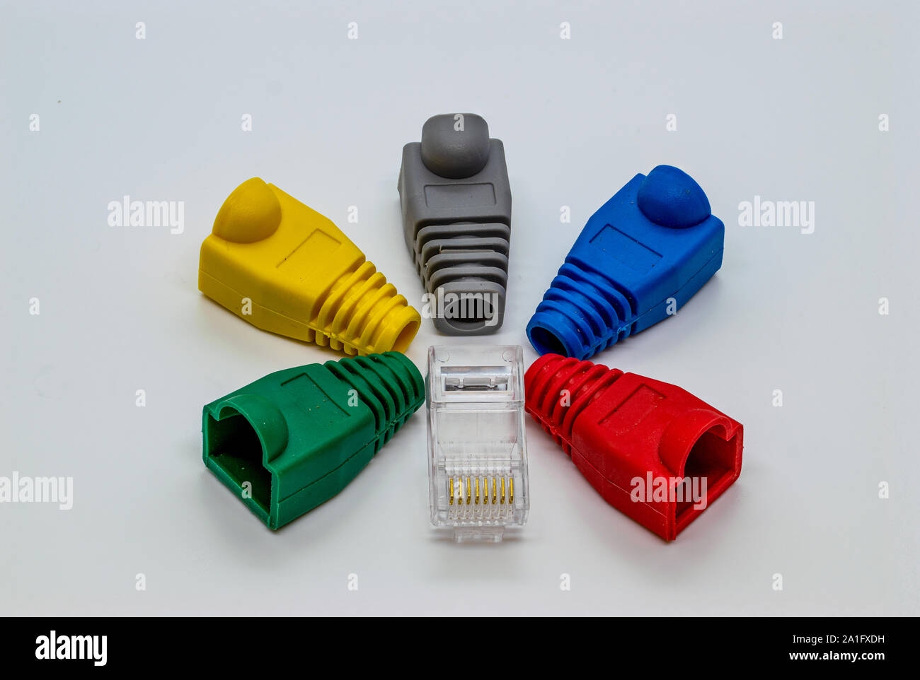 RJ45 Crimp connector with green yellow grey blue and red colored strain ...