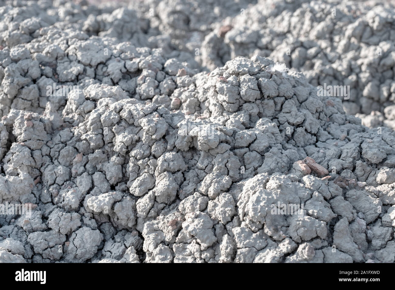 Dried ground with cracks. Grey land us a symbol ecological catastrophe ...