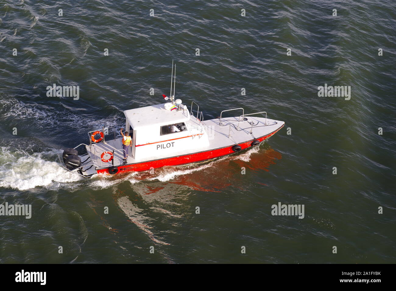 Pilot waves goodbye to a cruise ship departing cartagena, Colombia ...