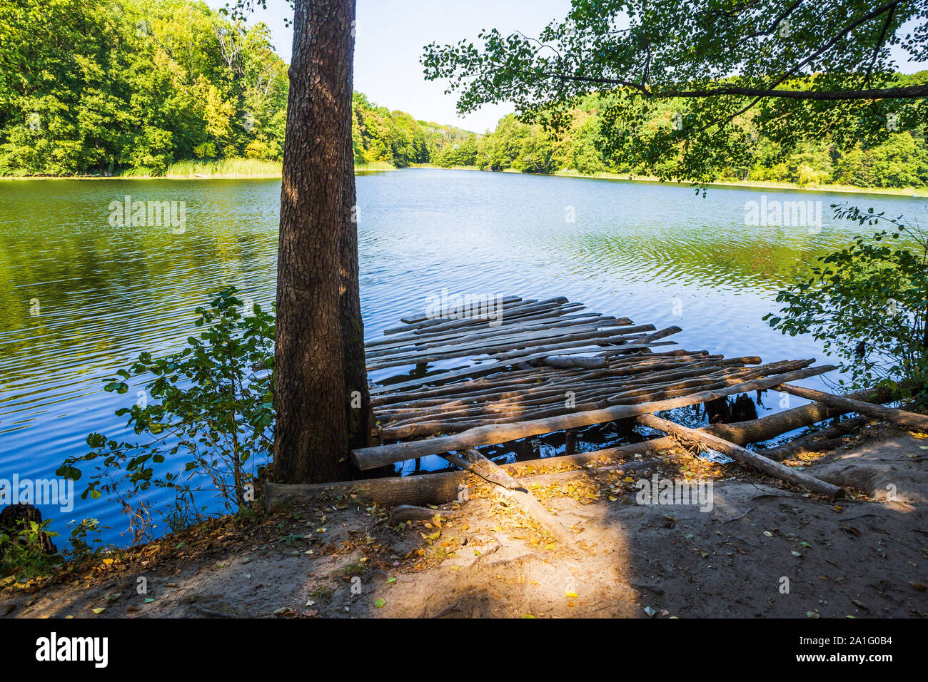 Landscape of the countryside lake shore and pole staging Stock Photo ...