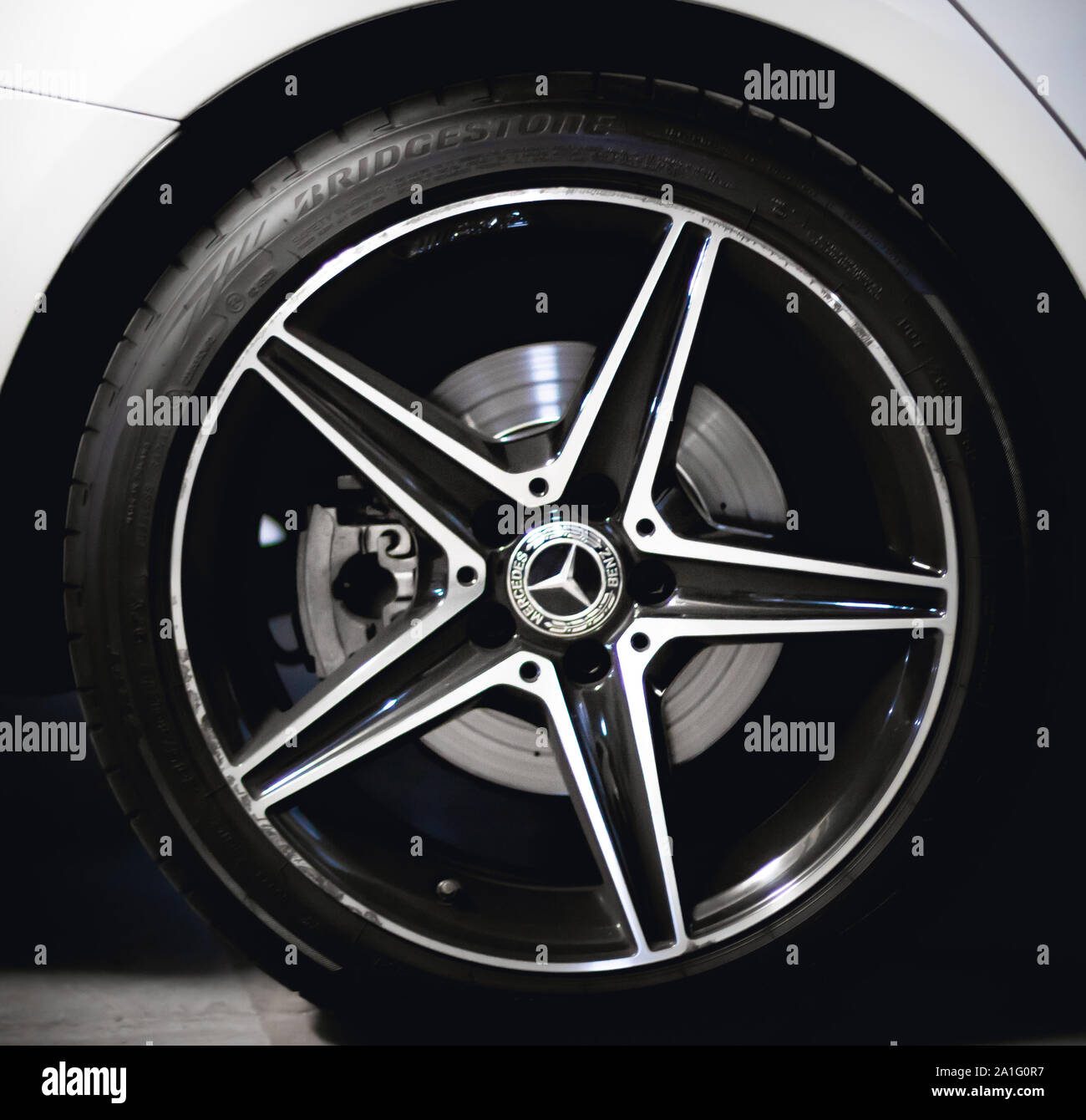 Photograph of a sports wheel of a mercedes benz car Stock Photo - Alamy