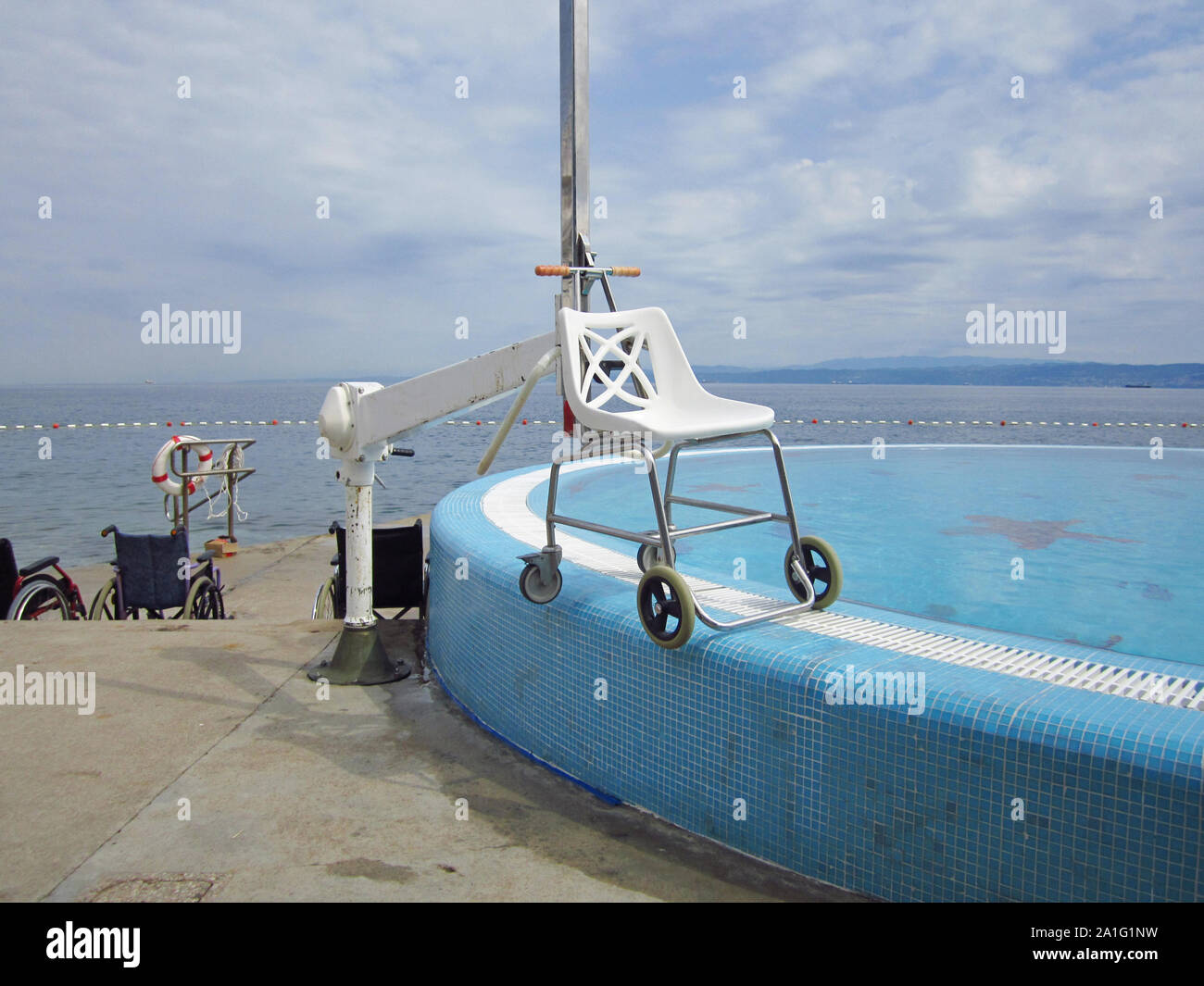 Adapted beach and pool with lift for disabled swimmers Stock Photo - Alamy