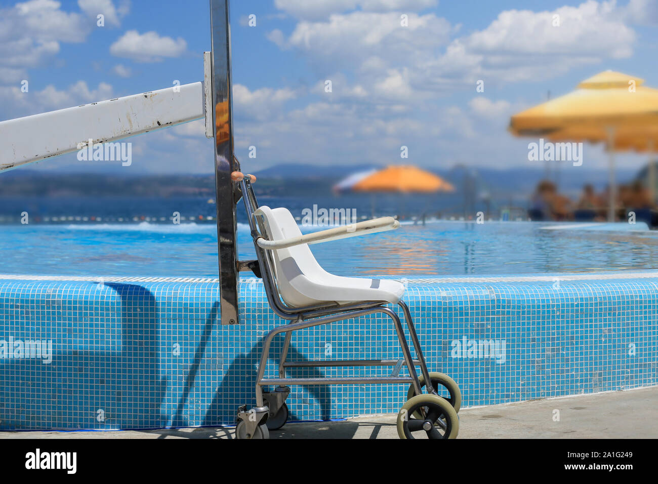 Adapted beach and pool with lift for disabled swimmers Stock Photo - Alamy