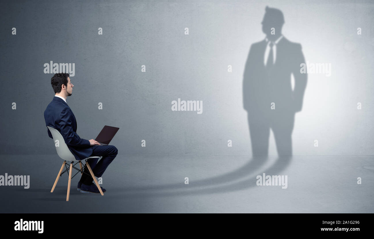 Humble businessman staying and offering stuffs to a huge businessman ...