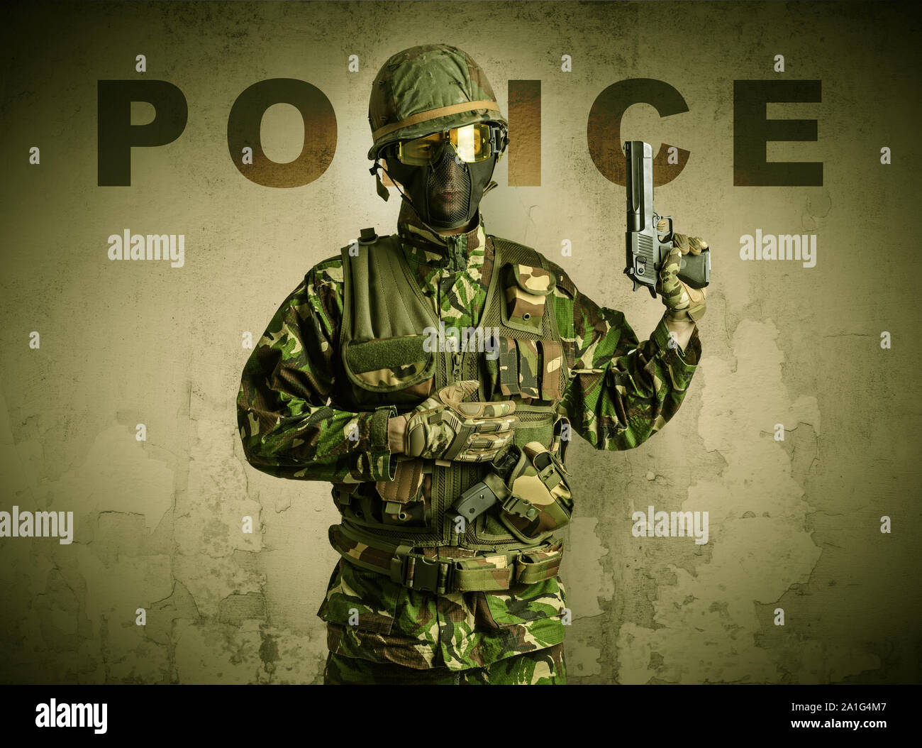 Uniformed armed soldier with damaged wall background Stock Photo - Alamy