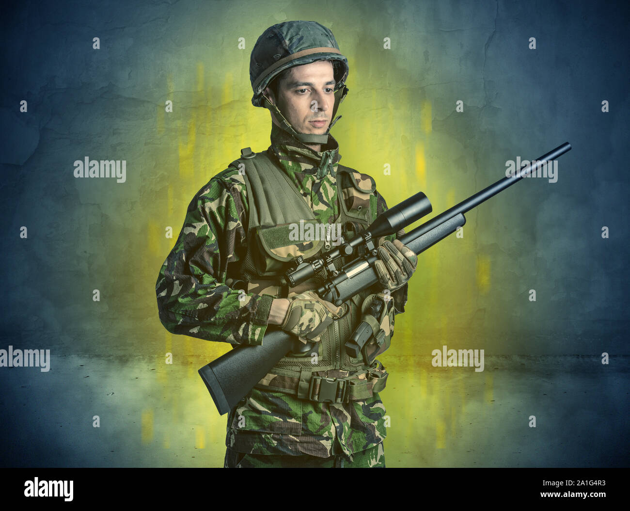 Hazard, menace soldier in a ruined crumbly building with arms on his ...