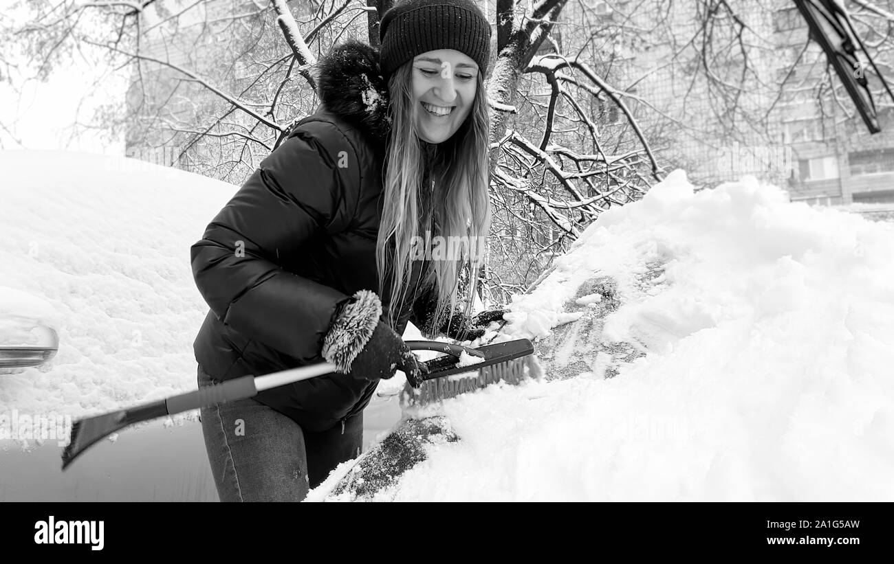 Woman driving car snow Black and White Stock Photos & Images - Alamy