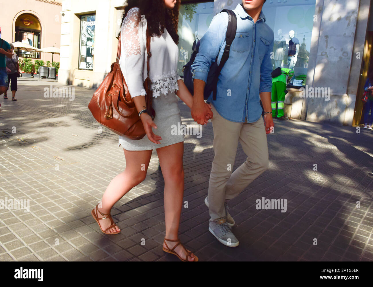Stylish young couple walking hand hi-res stock photography and images ...