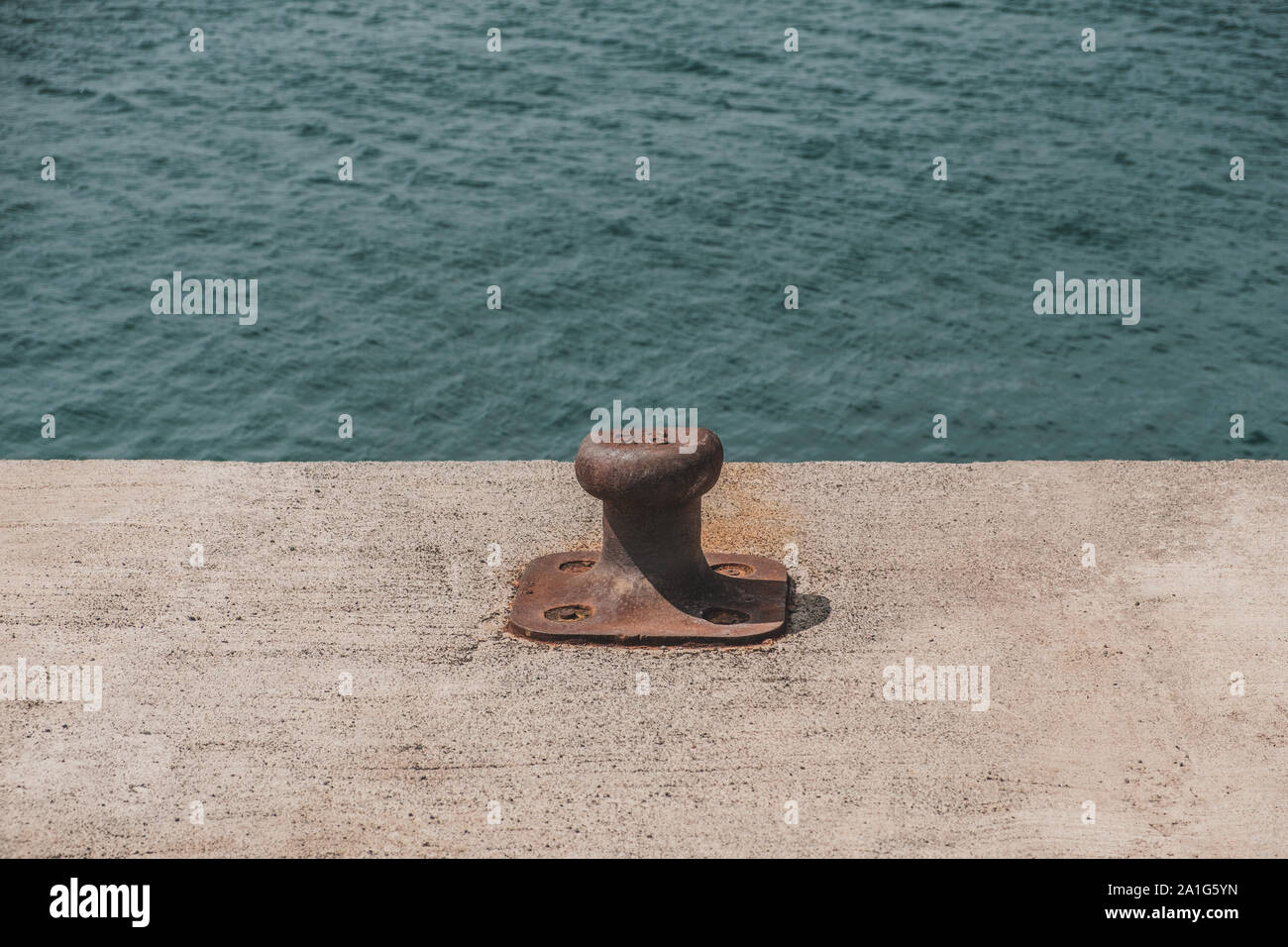 Empty coastal mooring or towing bollard for the boat, yacht or vessel ...