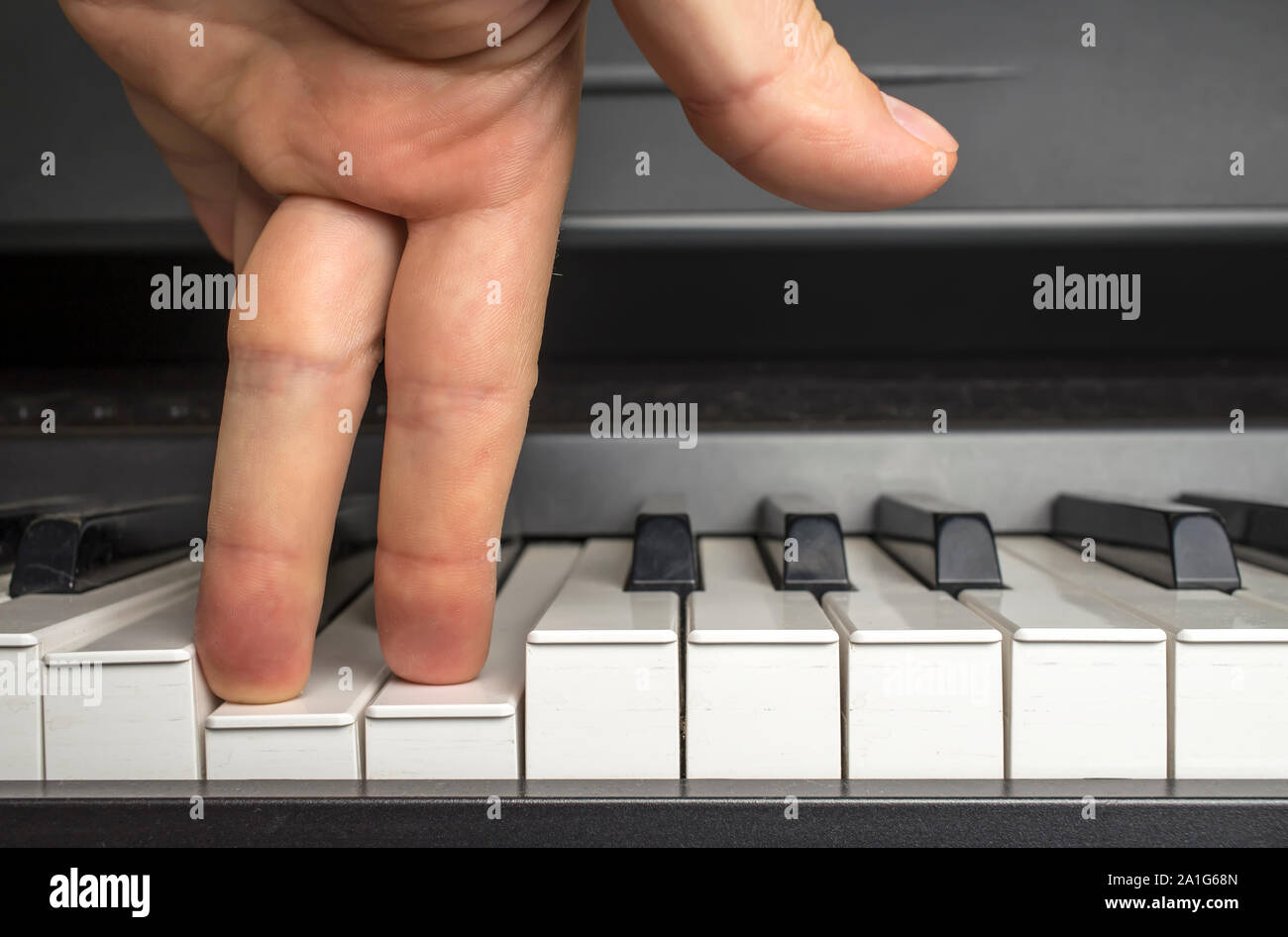 fingers click on the piano keys as if the legs Stock Photo - Alamy