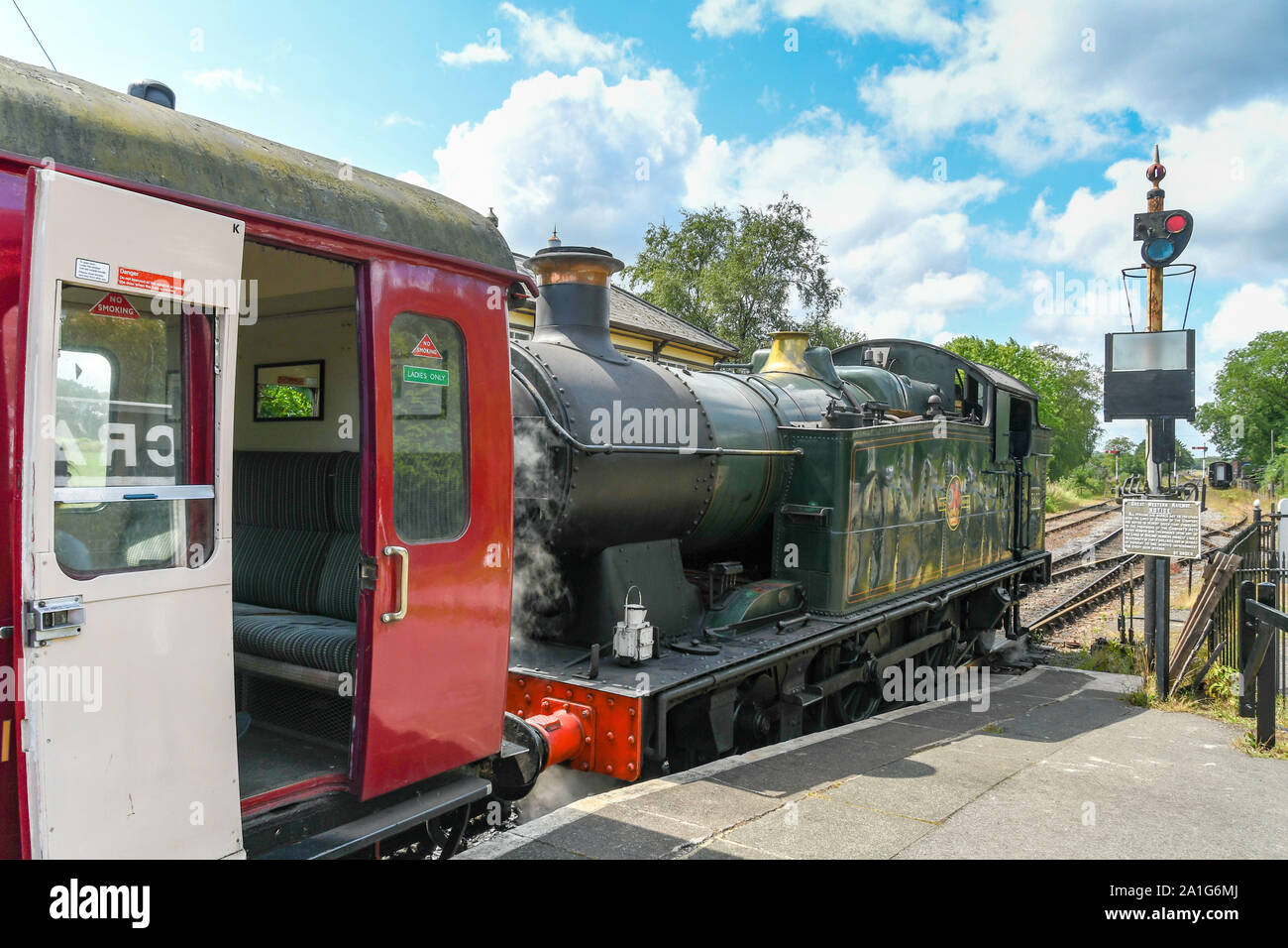 CRANMORE, ENGLAND - JULY 2019: Steam engine and train of carriages ...