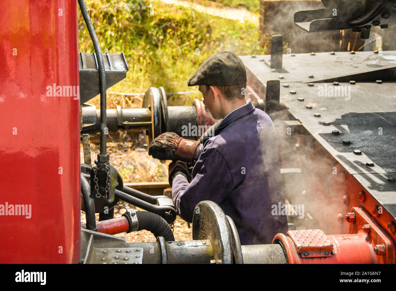 CRANMORE, ENGLAND - JULY 2019: Steam train worker coupling a steam ...