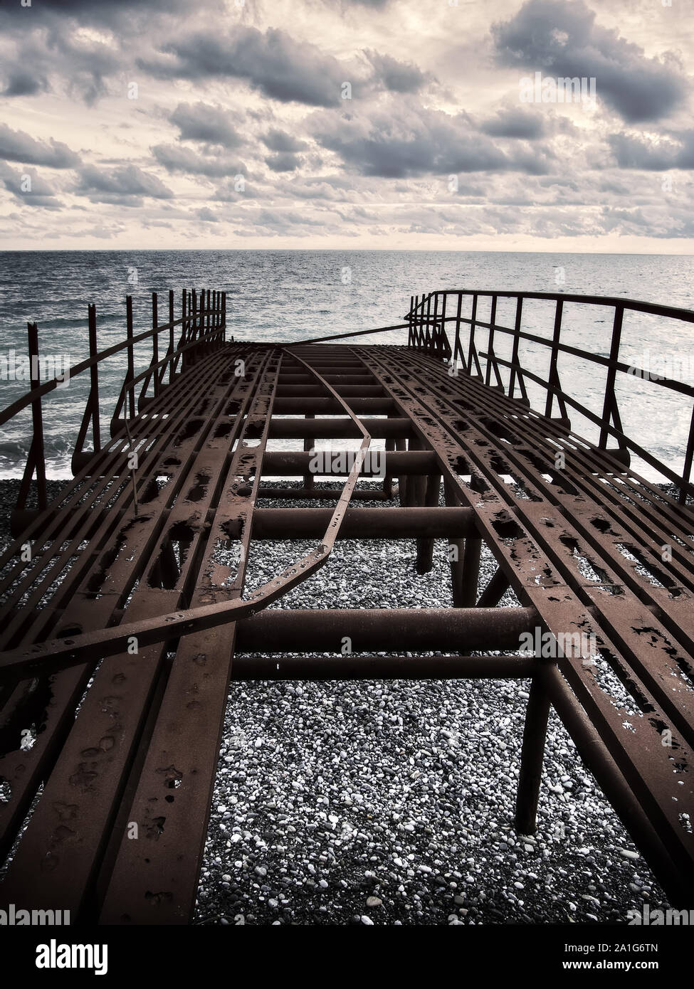 Gloomy rusty sea berth for ships. Metal industrial building in seaport ...