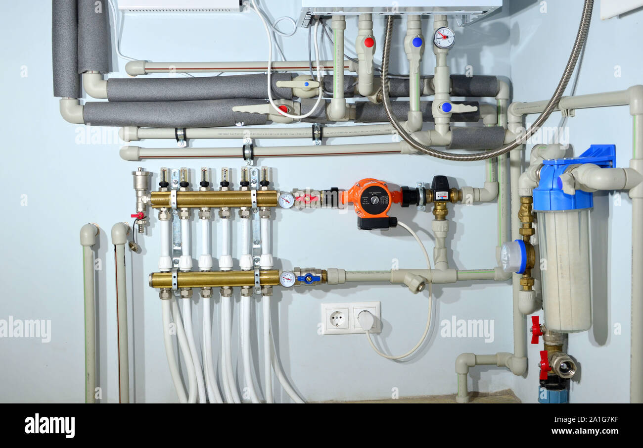 Pump with a thermometer for a water underfloor heating system at home ...