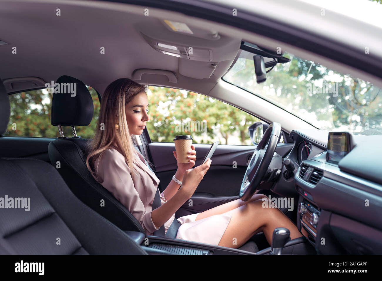 woman driving car summer city, parking lot traffic jam while waiting ...