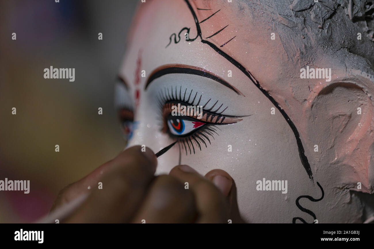 An artist works on a statue of goddess durga ahead of the festival ...