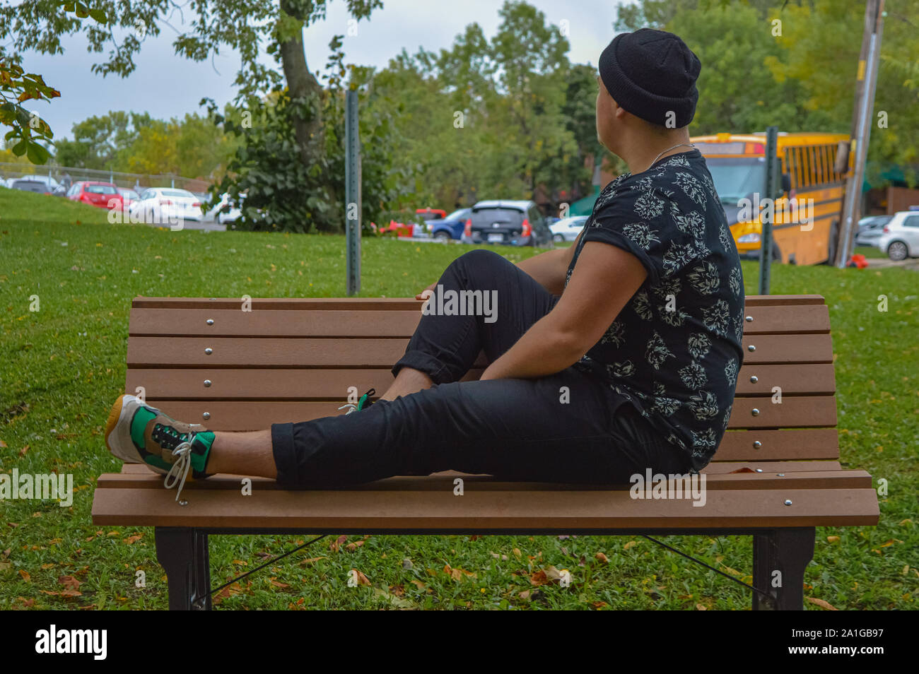 Teen on bench Stock Photo - Alamy