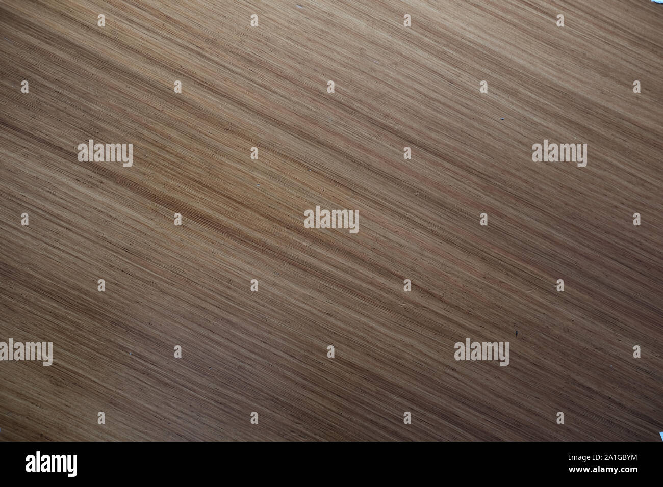 Light and dark streaks cross this wooden table making a beautiful ...