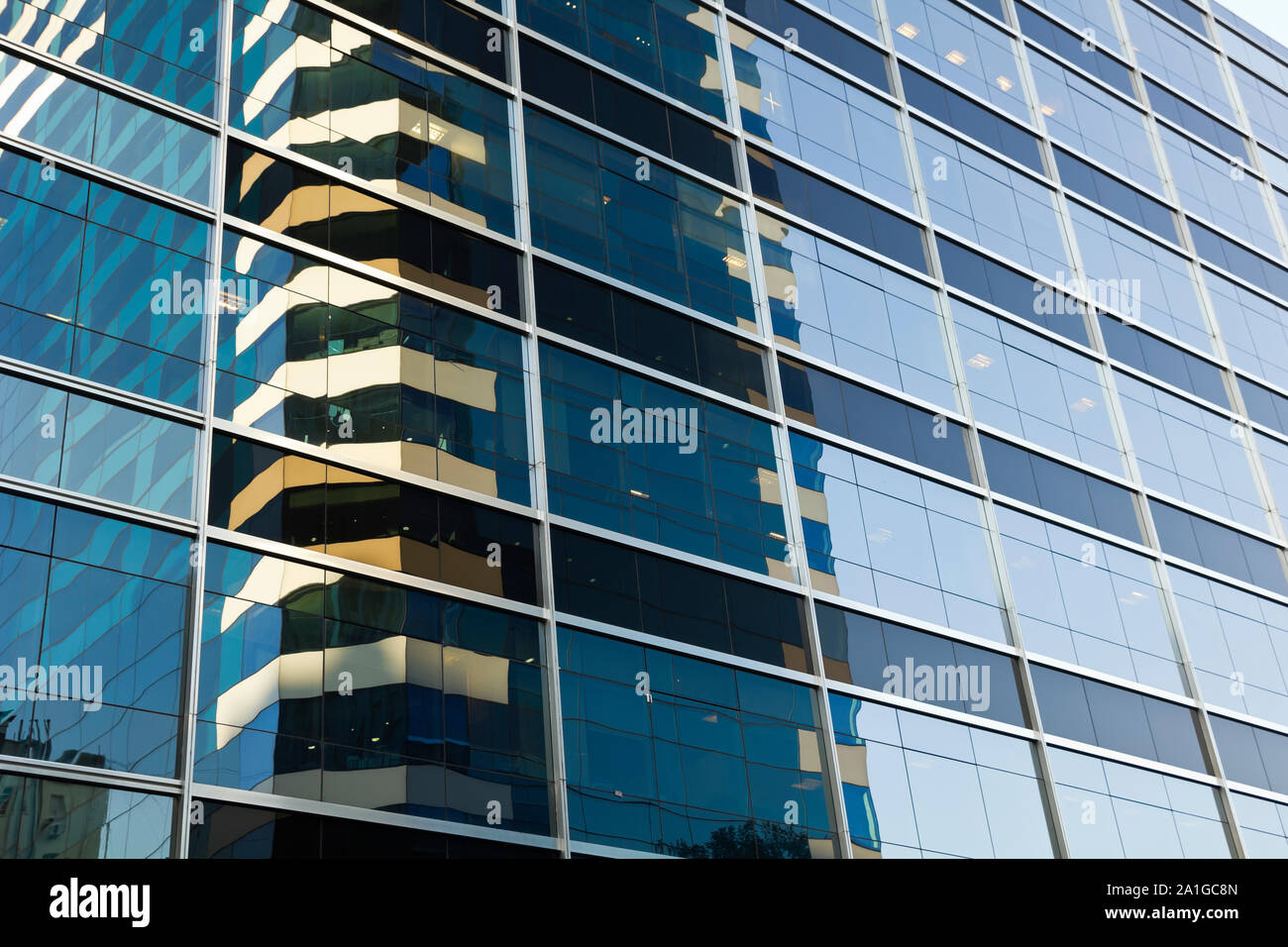Modern glass reflection on modern building Stock Photo - Alamy
