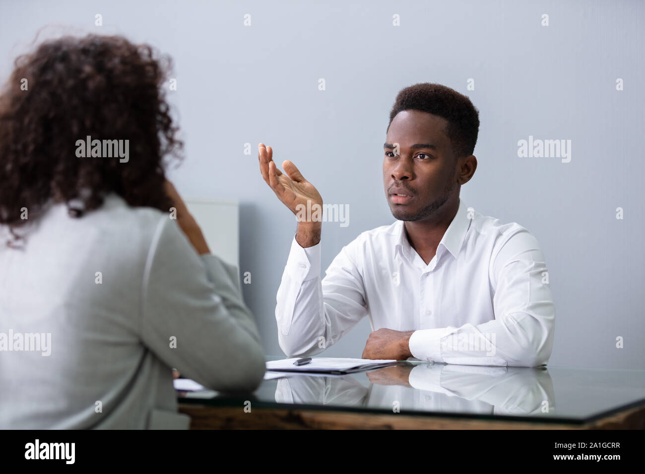 Stressed Young Business Man Failing Hard Interview In Office Stock ...