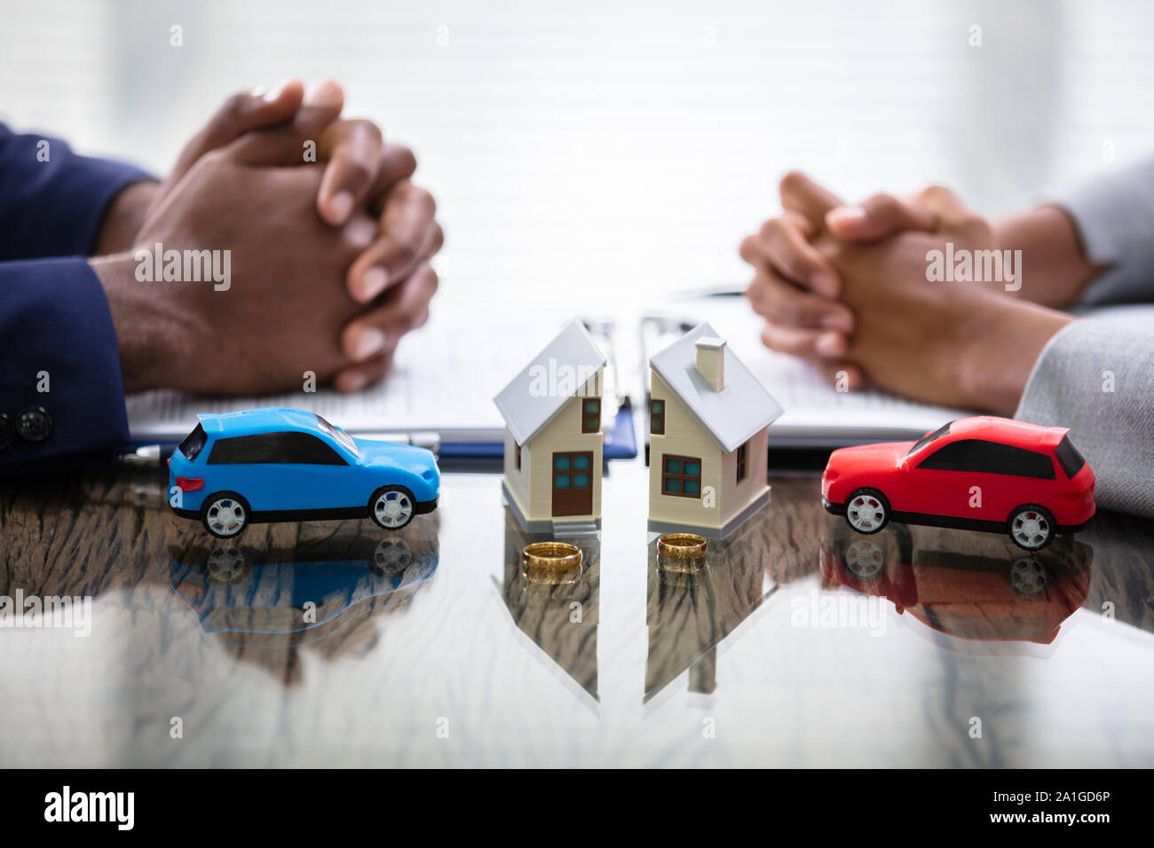 Wife And Husband Splitting House And Car During Divorce Process Stock ...