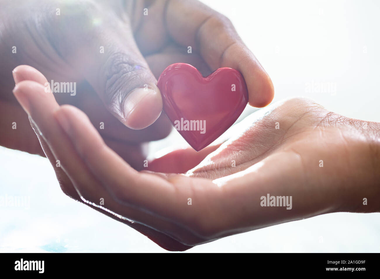 Hand giving heart hi-res stock photography and images - Alamy