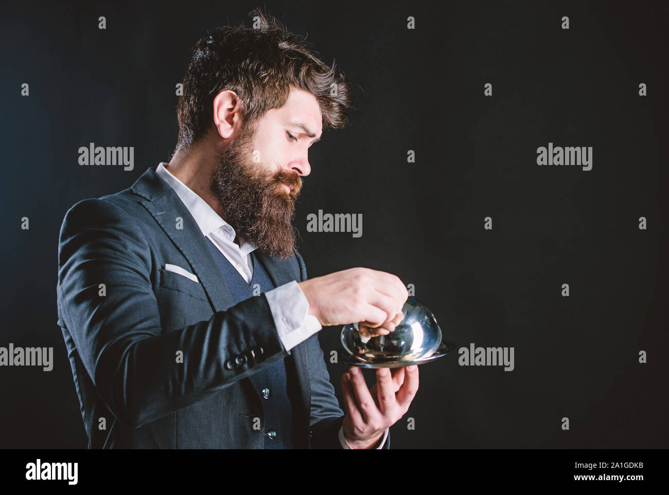 Man well groomed gentleman formal suit hold little cloche. Serving and ...
