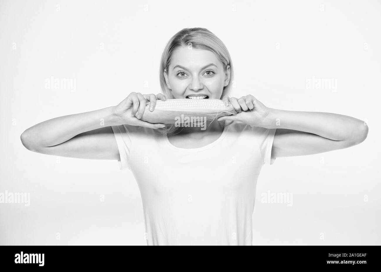 The crunch is perfect. Happy woman eating corn. vegetable harvest. corn ...