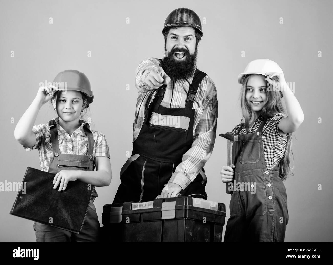 Father and daughter in workshop. Family teamwork. Repair. Repairman in ...