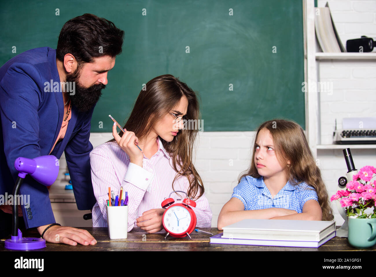 Learn to love to learn. Family back to learn. Little child and parents ...