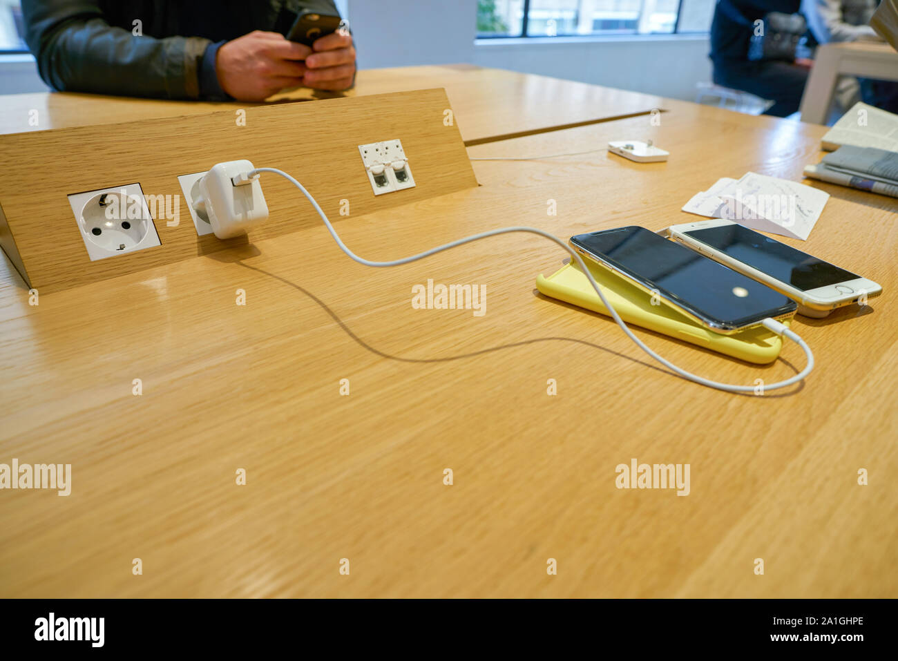 COLOGNE, GERMANY - CIRCA OCTOBER, 2018: a phone charging at Apple store ...