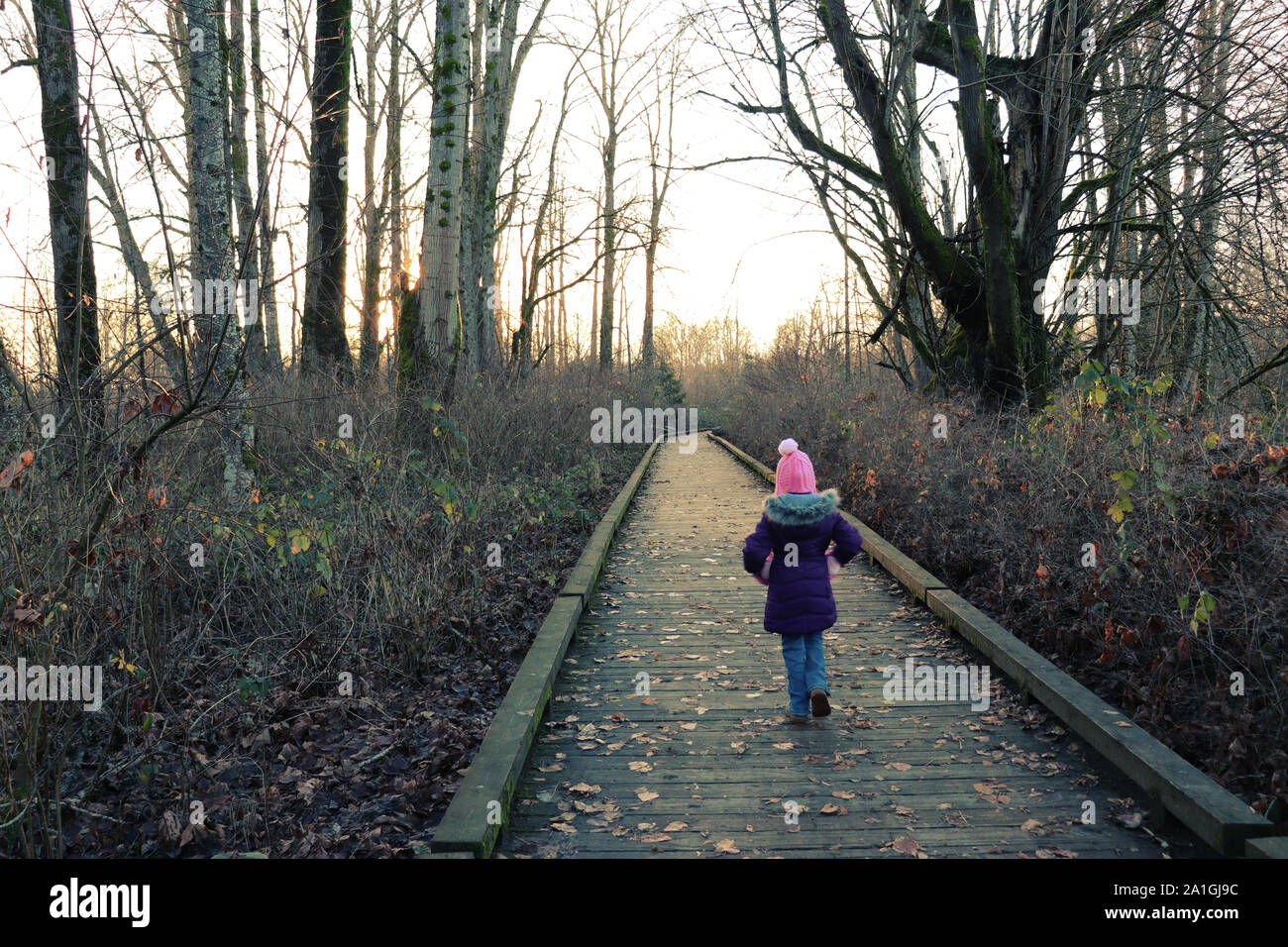 Child out for a walk during cold fall winter weather Stock Photo - Alamy