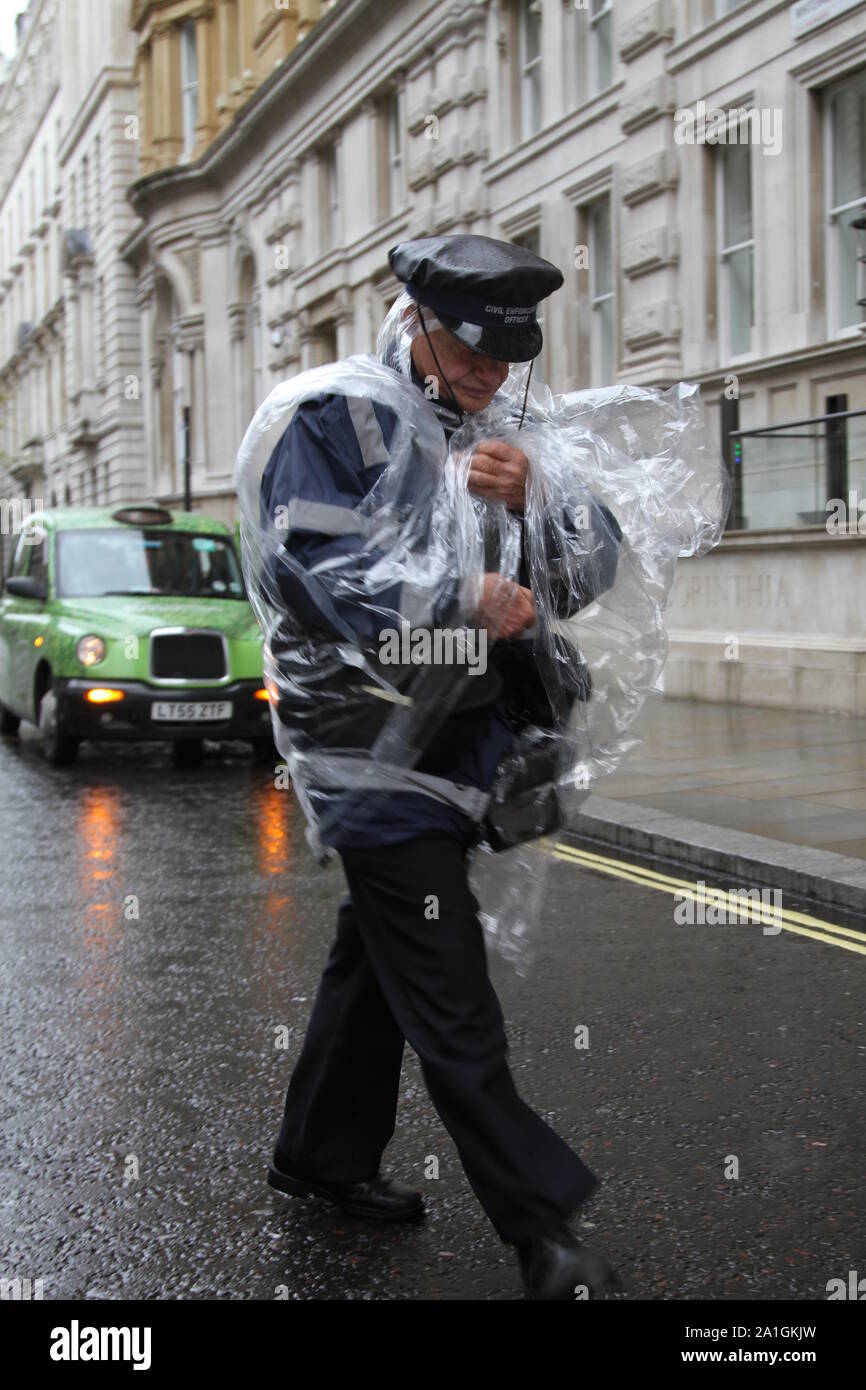 Civil enforcement officer on duty on the streets of London. Miserable ...