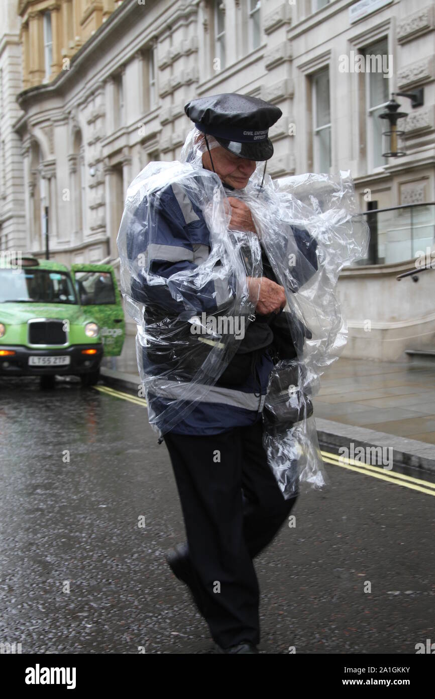 Civil enforcement officer on duty on the streets of London. Miserable ...
