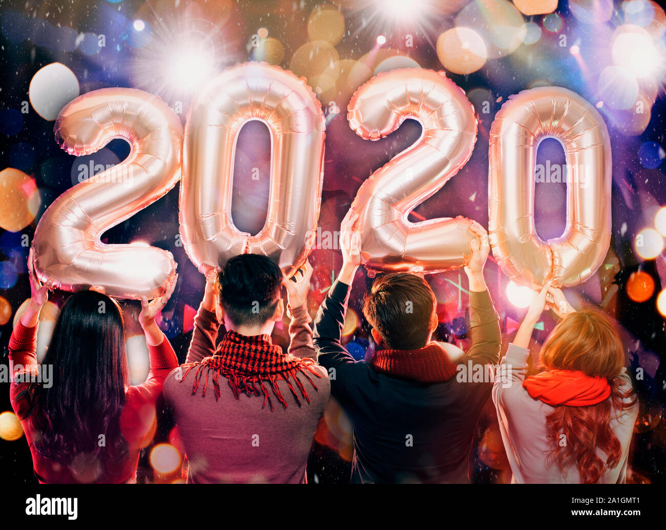 happy young group celebrating new year 2020 party Stock Photo - Alamy