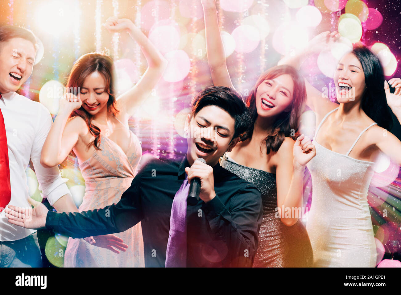 happy young group singing and dancing in party Stock Photo - Alamy