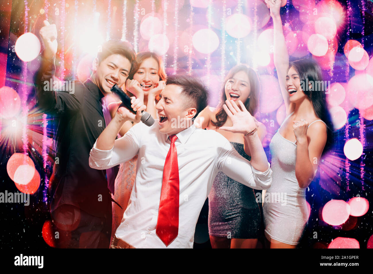 happy young group singing and dancing in party Stock Photo - Alamy