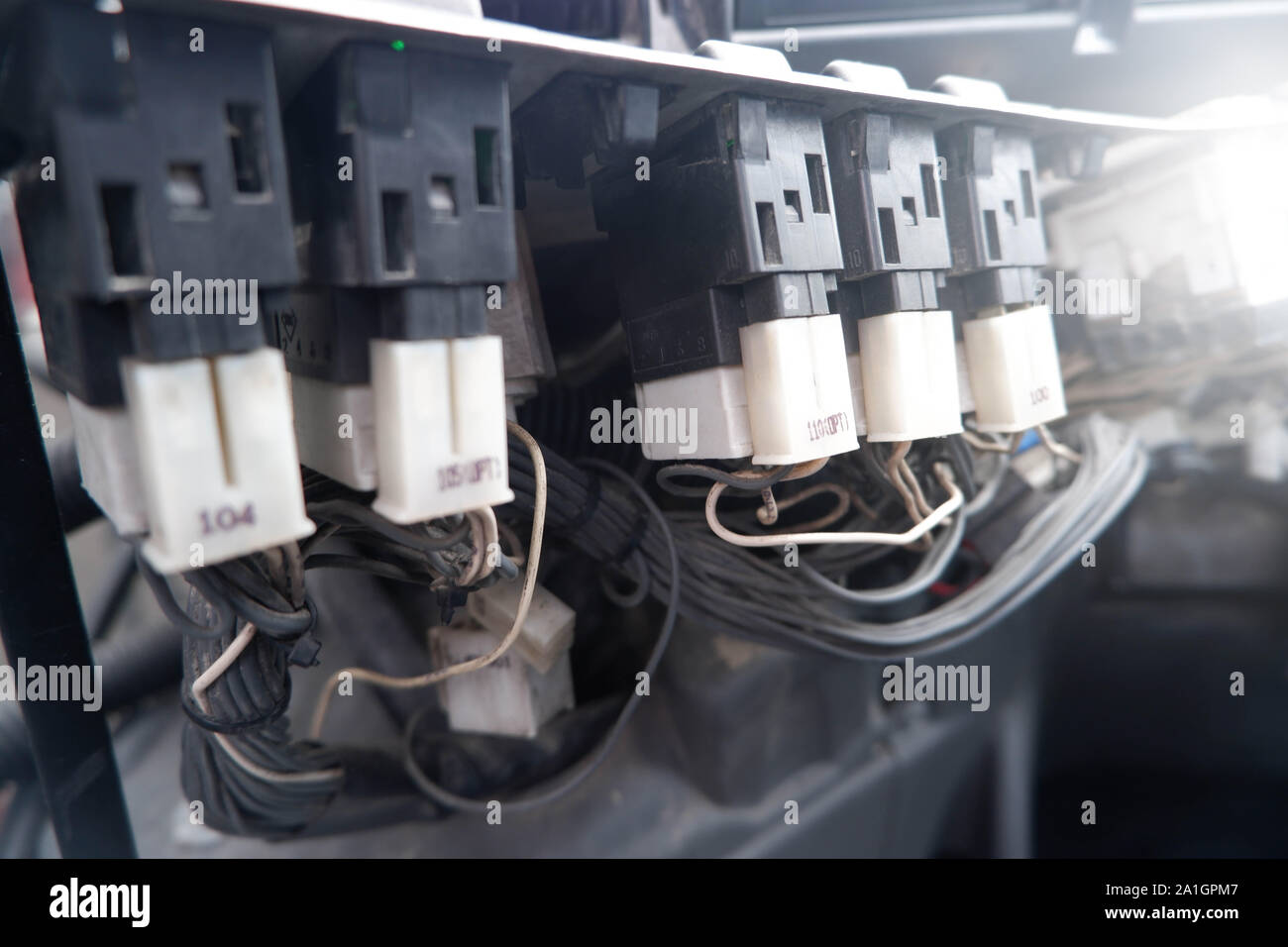 Plug the power cable into an electrical outlet Stock Photo - Alamy