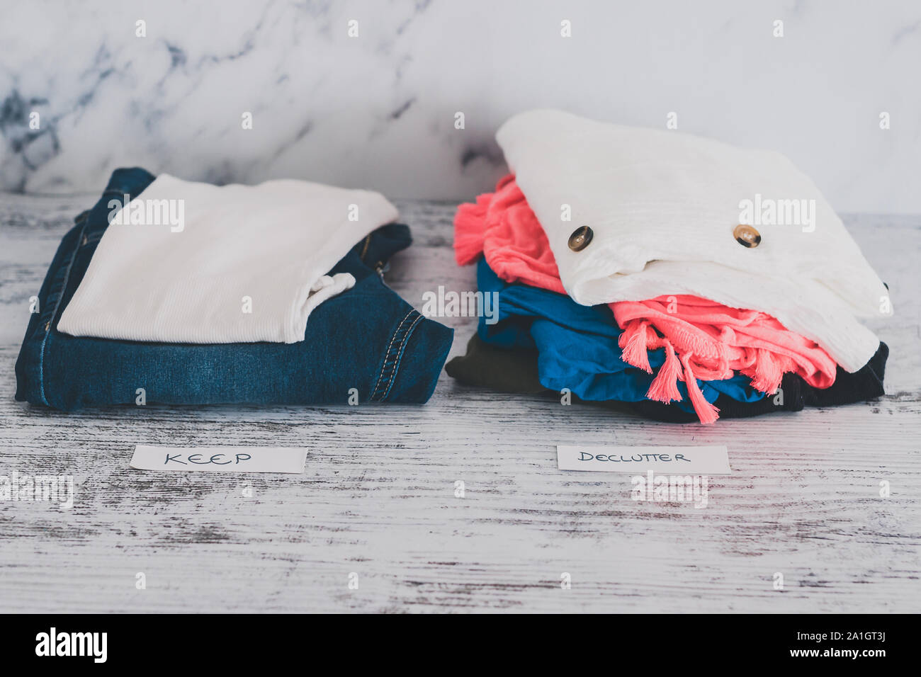 declutter and tidying up concept, fashion clothes folded and stacked ...