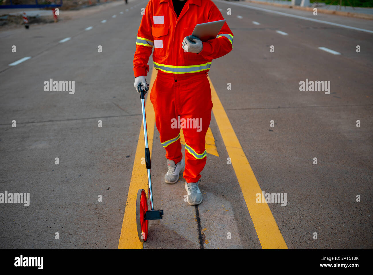 Road worker holding measuring wheel hi-res stock photography and images ...
