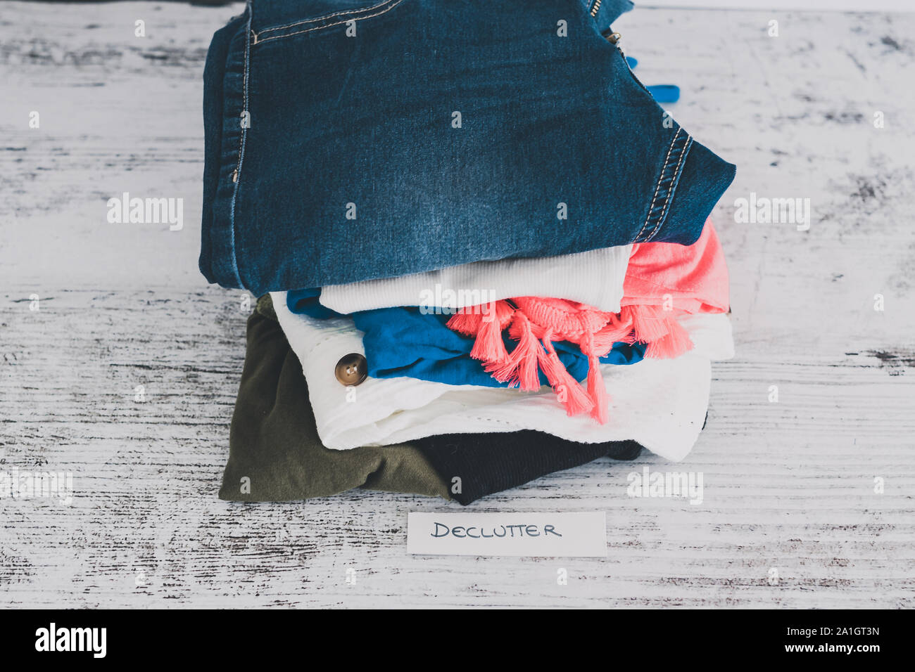 declutter and tidying up concept, fashion clothes folded and stacked ...