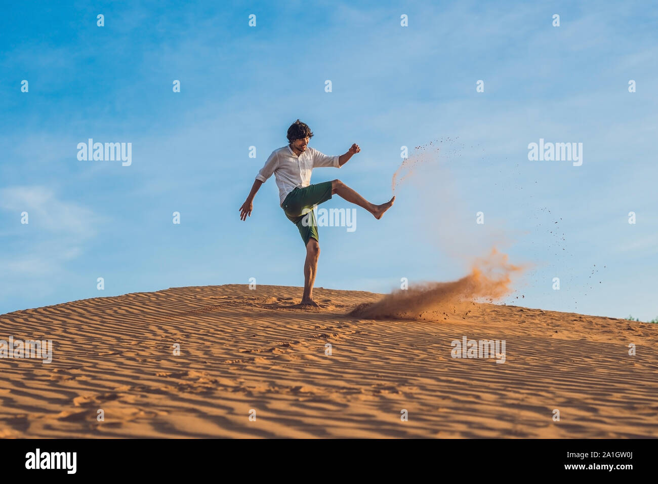 Kicking sand hi-res stock photography and images - Alamy