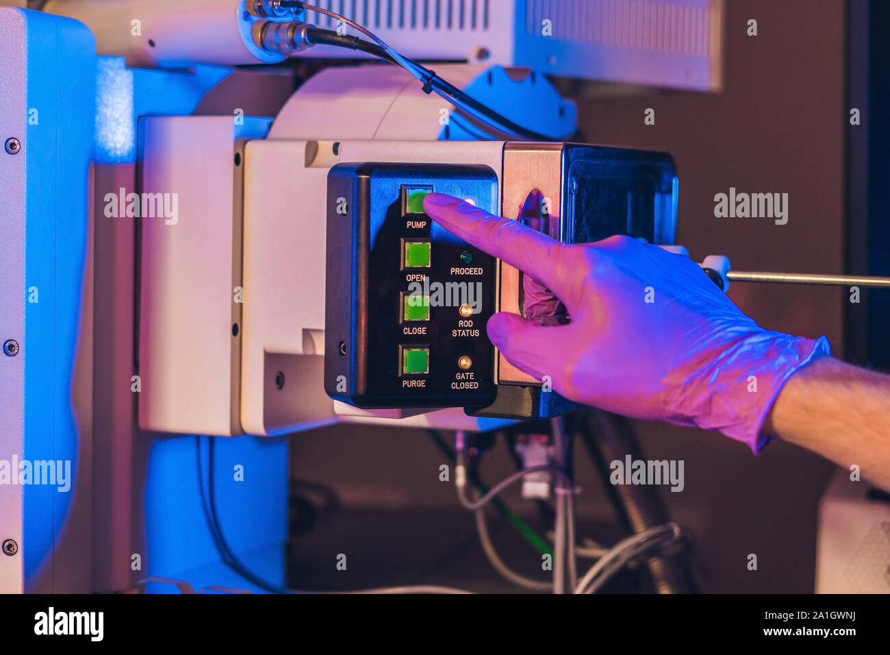 Scientist in a laboratory works with an electron microscope gateway ...