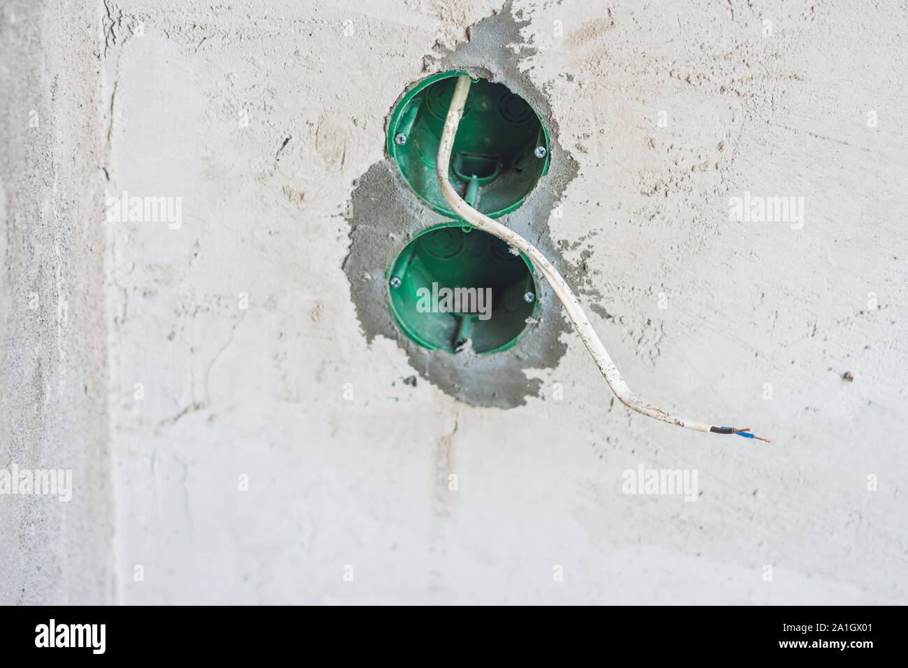 Socket and electrical wires on the wall, home renovation concept Stock ...