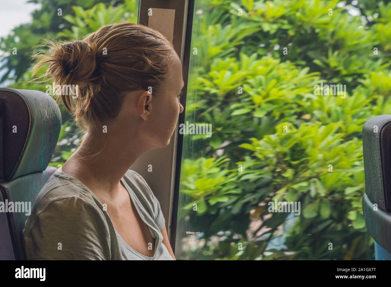 beautiful young woman taking bus to work Stock Photo - Alamy