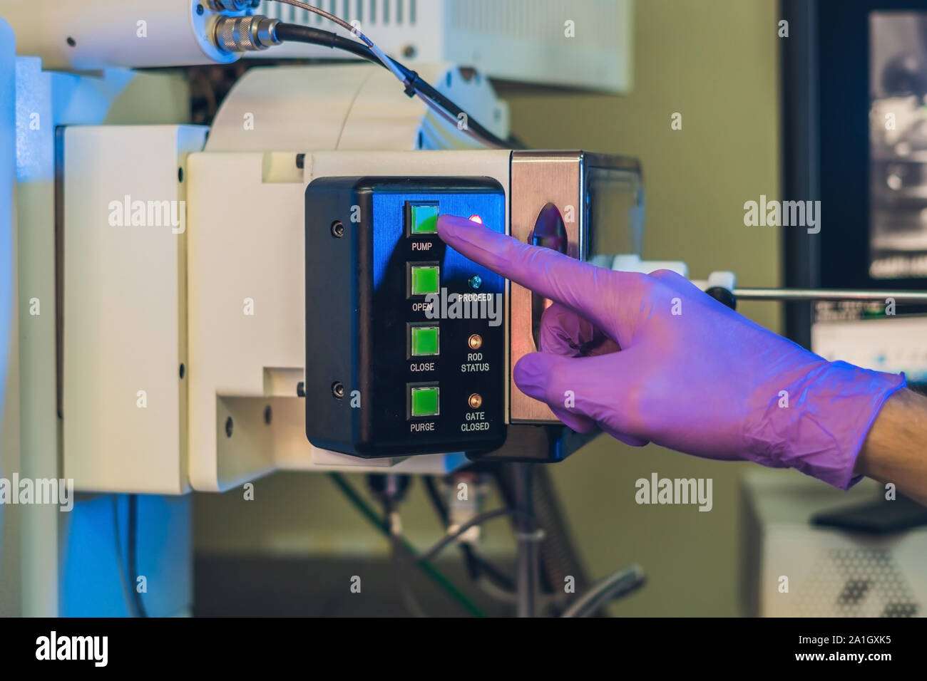 Scientist in a laboratory works with an electron microscope gateway ...