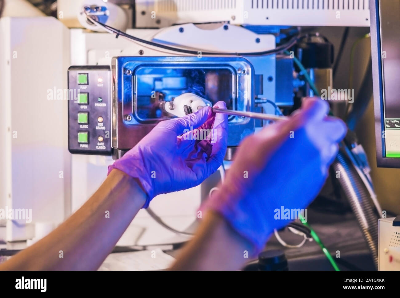 Scientist in a laboratory works with an electron microscope gateway ...