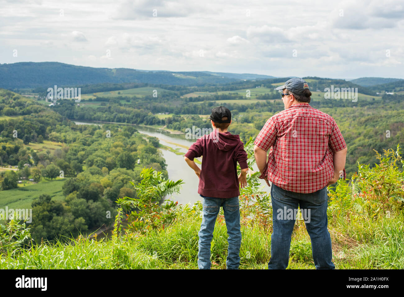 Two people look out over the vast green landscape in rural Pennsylvania ...